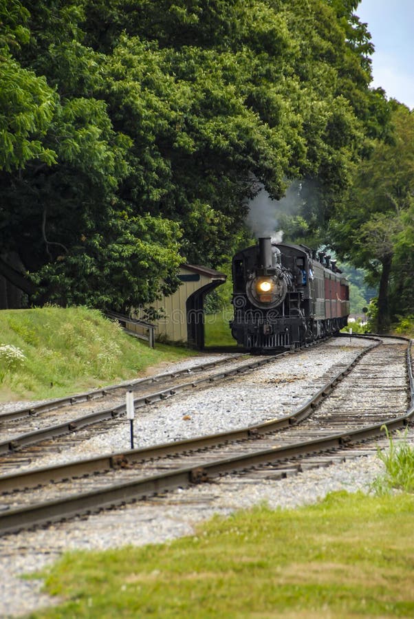 Steam Engine with Passenger Train Pulling into Station Pt 1 Stock Photo ...