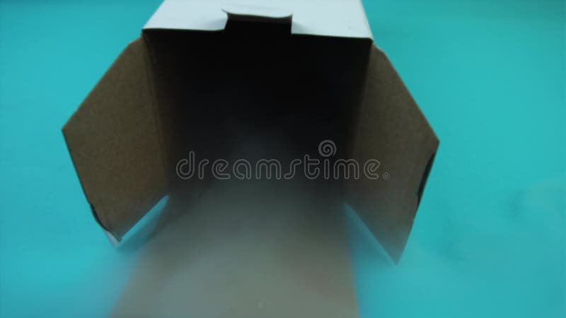 Steam Flows Out of Open Cardboard Box on Turquoise Macro Stock Footage ...