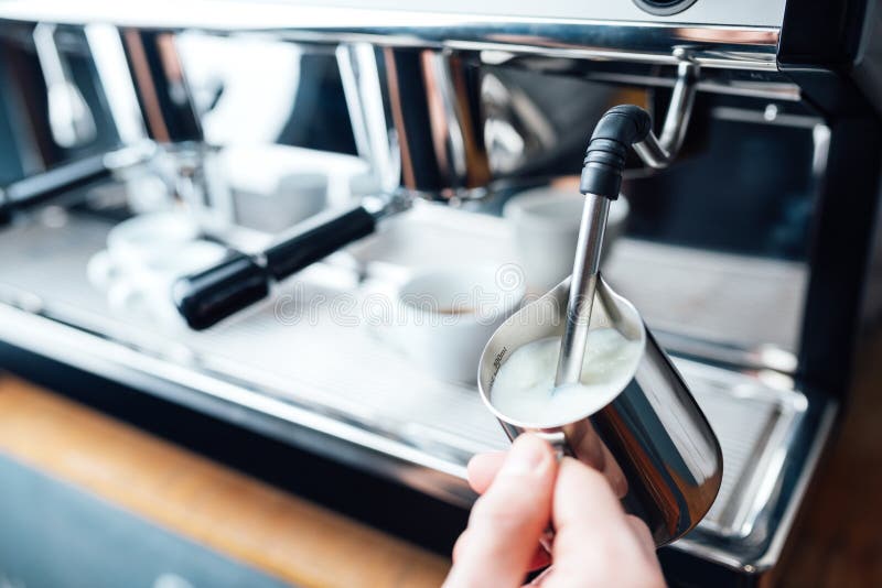 Steam Frothing Milk Under Pressure from a Coffee Machine in Pitcher ...