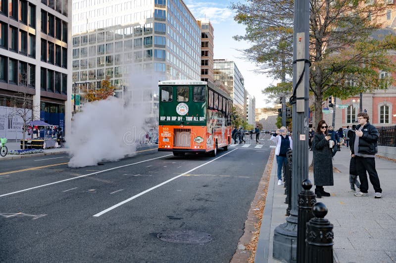 Steam from Hatches and Washington DC Sightseeing Bus in the Historic ...