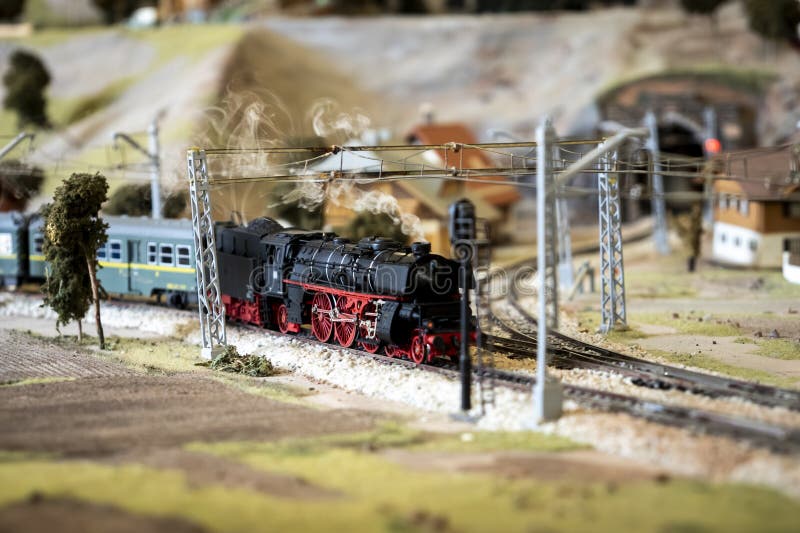 Steam Model Train Blowing Smoke with Blurred Background Stock Photo ...