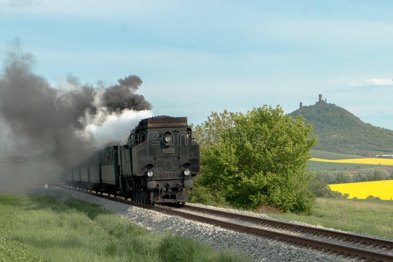 A Steam Passenger Train Arrives Stock Image - Image of vehicle, rusty ...