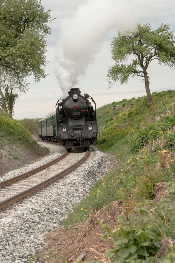 A Steam Passenger Train Arrives Stock Photo - Image of locomotive ...
