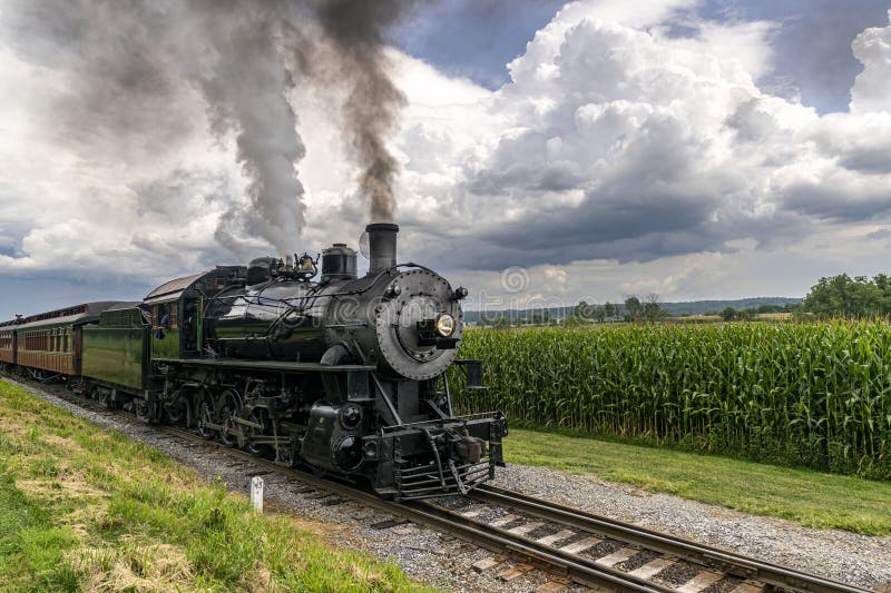 Steam Passenger Train Passing Corn Fields and Blowing Smoke on a Sunny ...