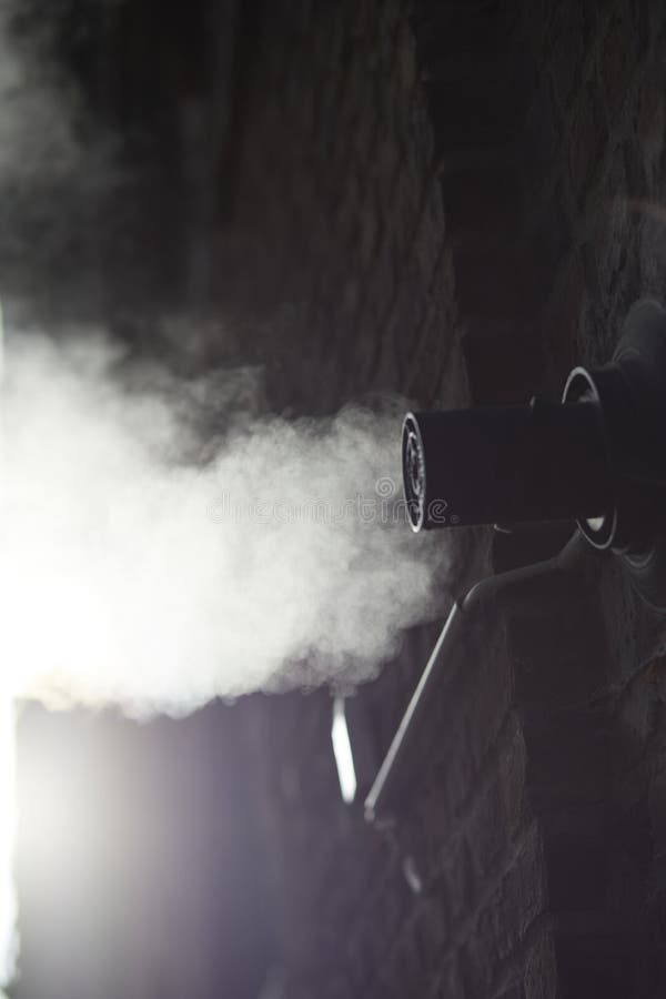 Steam from a Pipe Foxed in a Brick Wall of an Old Building. Shot with ...