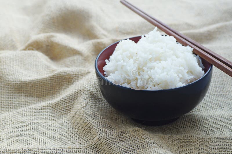 Steam rice in bowl stock photo. Image of cooked, black - 99983606