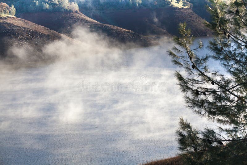 Steam Rises Above the Reservoir. Stock Image - Image of outdoor, orange ...