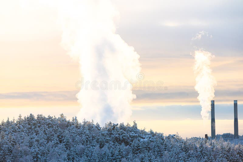 Steam Rising from Industry Behind Winter Forest.. Stock Image - Image ...