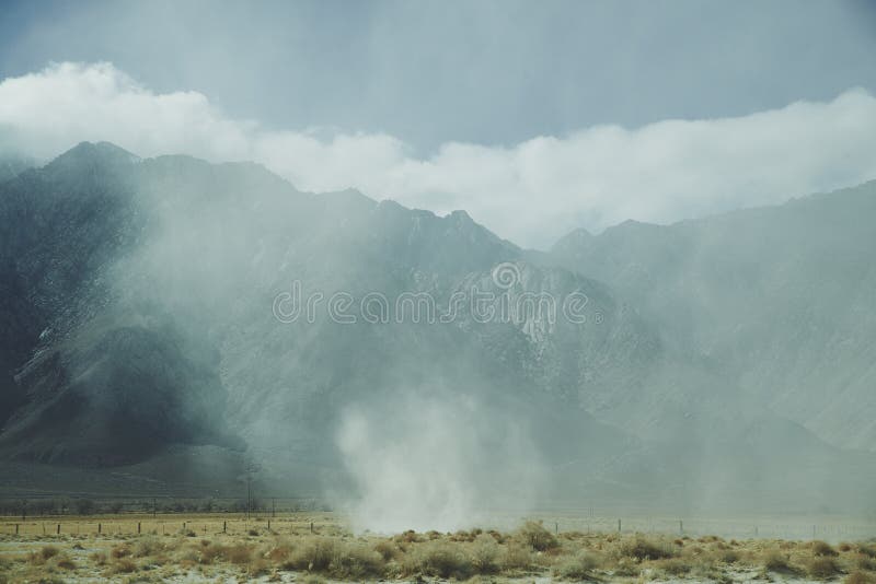 Steam Rising from Landscape in Front of Mountains Stock Image - Image ...