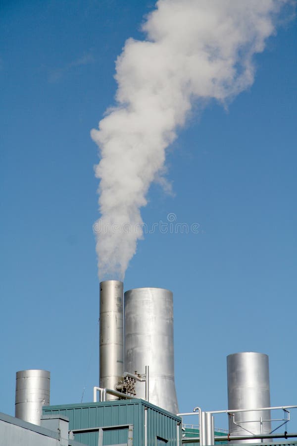 Steam rising from a tower stock image. Image of tube, factory - 535587