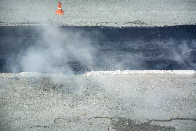 Steam is Rising Up Above the Fresh Asphalt. Stock Image - Image of ...