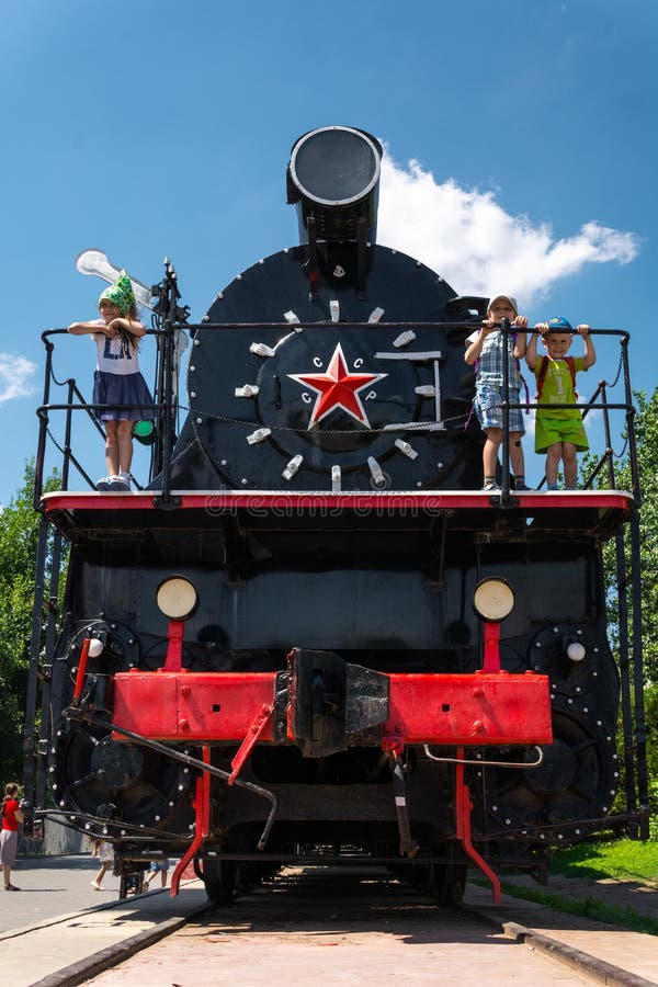 Children`s Steam Locomotive with a Mini Tank Attached in the Park .May ...