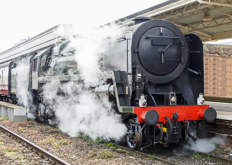 Steam Train at Station stock photo. Image of front, steel - 54666254