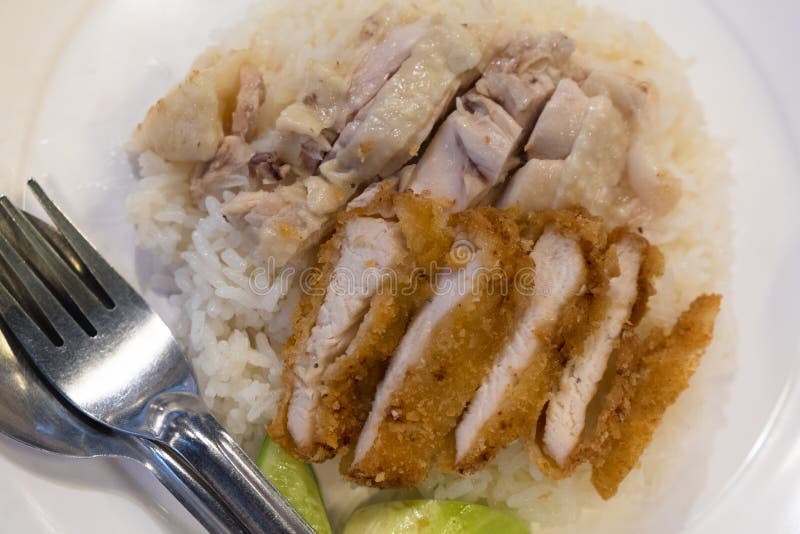 Steamed Chicken Mixed with Fried Chicken Rice on White Plate Stock ...