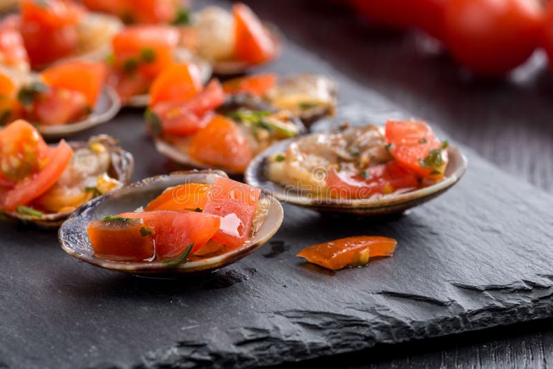 Steamed Clams Served with Chunks of Fresh Tomato and Parsley Stock ...