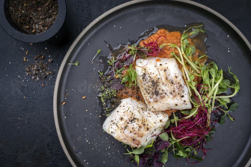 Steamed Cod Fish Filet with Lettuce on a Modern Design Plate Stock ...