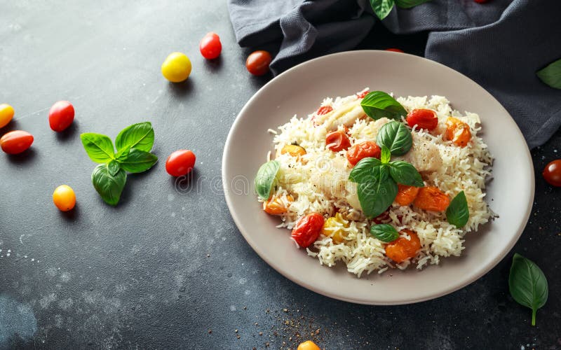 Steamed Cod Fish with Rice and Cherry Mix Tomatoes and Basil Herbs in a ...