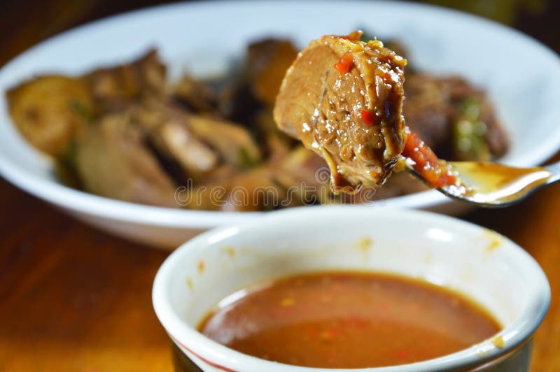 Steamed Duck Meat Stab in Fork Dipping with Spicy and Sour Sauce Stock ...