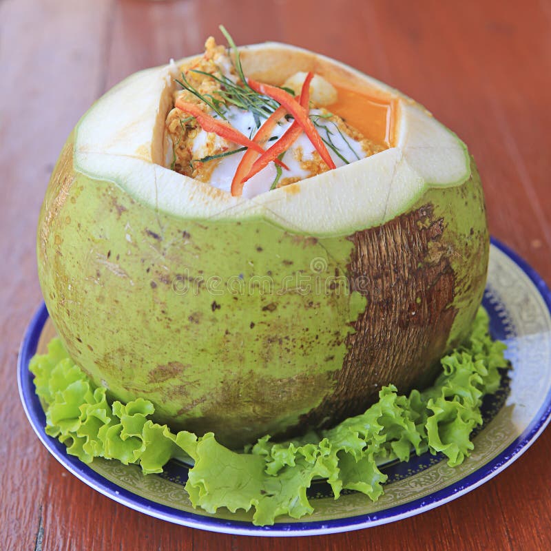 Steamed Fish and Seafood with Curry Paste in Coconut Stock Photo ...
