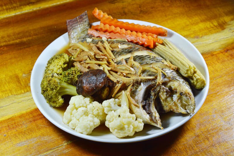 Steamed Mango Fish with Slice Ginger and Vegetable in Soy Sauce on Dish ...