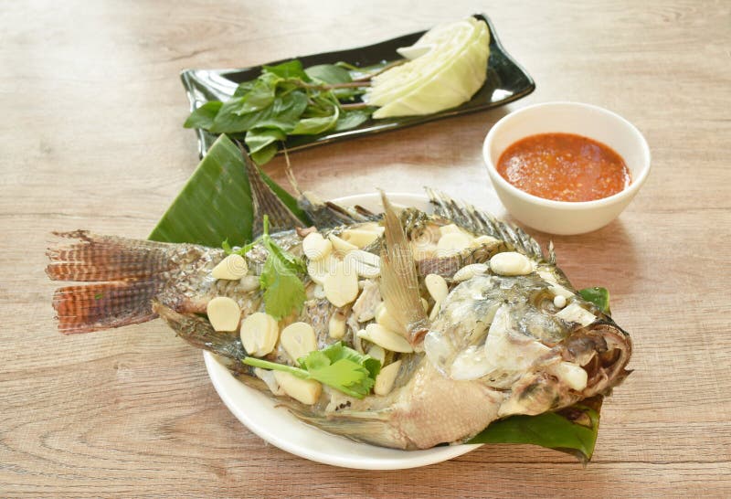 Steamed Mango Fish with Vegetable Dipping Spicy Sauce on Plate Stock ...