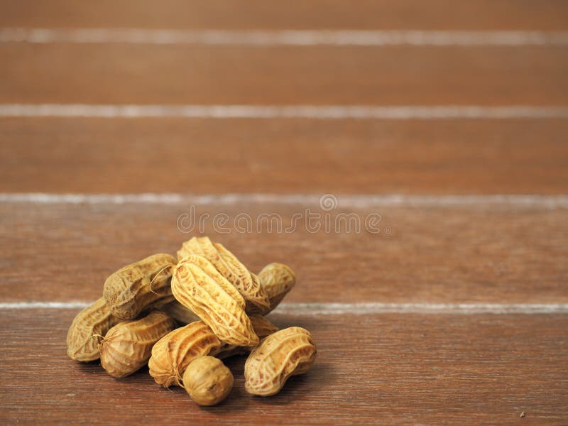 Steamed Peanut Pile on Wooden Plank Table Top,Selective Focus. Stock ...