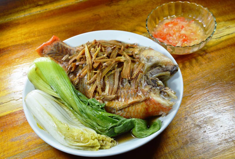 Steamed Red Mango Fish with Vegetable Topping Slice Ginger Dipping ...