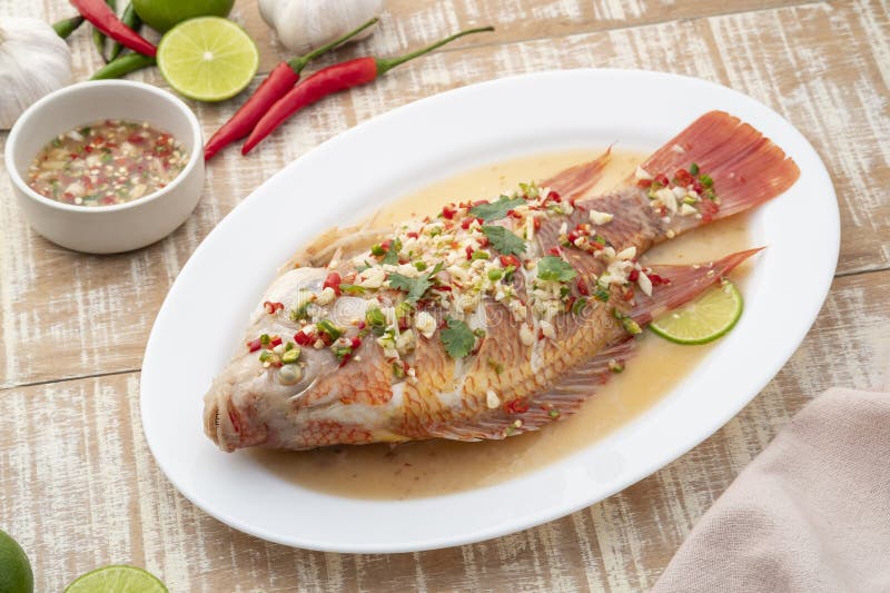 Steamed Red Tilapia Fish in Spicy Lime Soup Stock Photo - Image of fish ...
