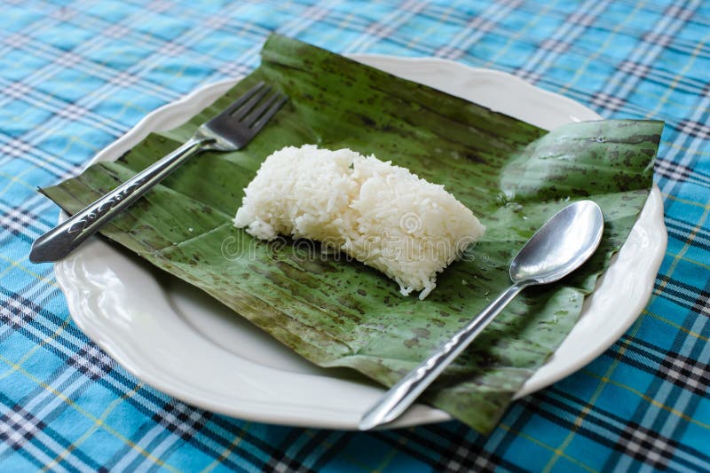 Steamed Rice with Banana Leaf Spoon and Folk on a Dish Stock Photo ...