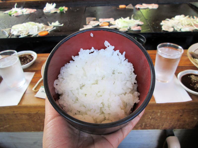 Steamed rice of Japan stock photo. Image of hands, lunch - 64671604