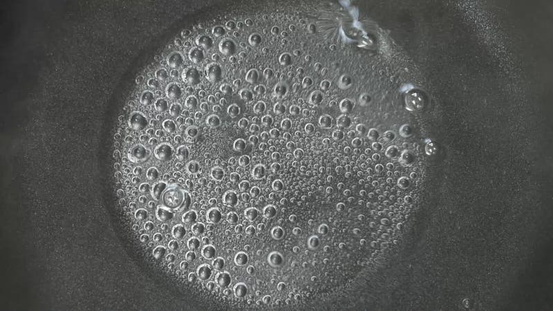 Steamed Water with Bubble Boiled in Black Electric Kitchen Pan Stock ...