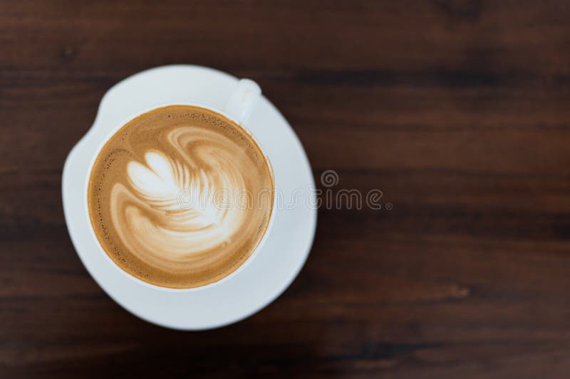 Steaming Hot Coffee with Latte Art in a Cozy Cafe Setting Stock Image ...