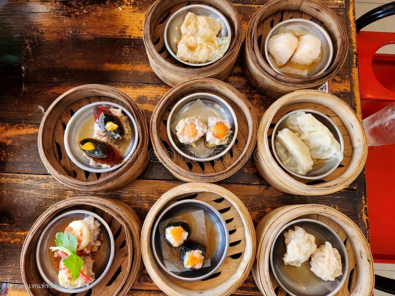 Steaming Hot Dim Sum Served in Bamboo Baskets on a Table. the ...
