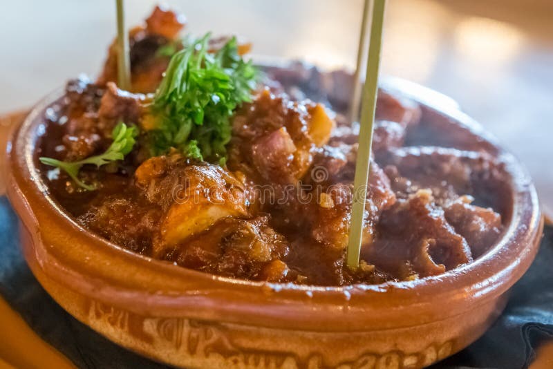 Spanish Tapas - Spicy Octopus Stock Image - Image of steaming, green ...