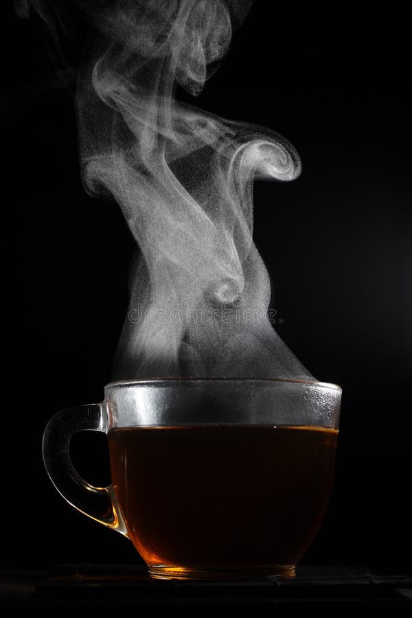Close-up of a Clear Glass Cup Full of Hot Tea on a Black Background ...