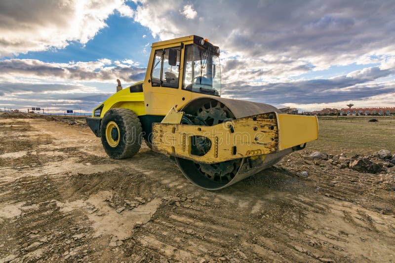 Steamroller Performing Leveling Work on a Road Under Construction Stock ...