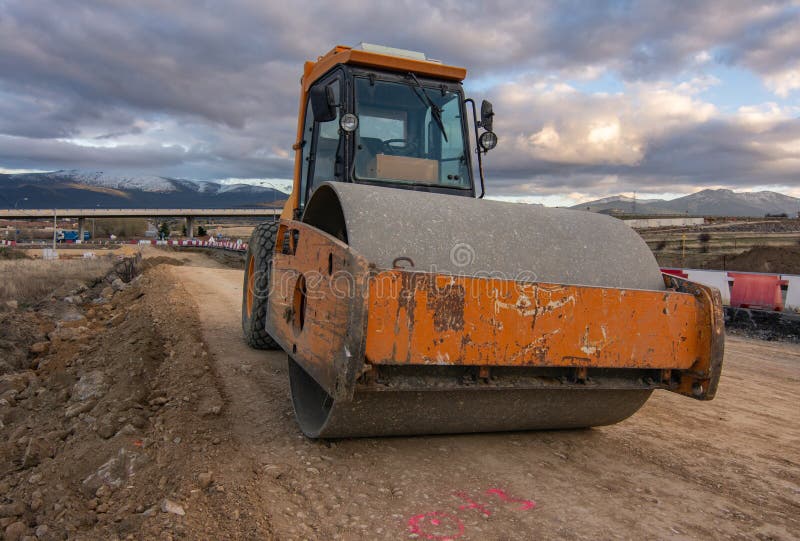 Steamroller Performing Leveling Work on a Road Under Construction Stock ...