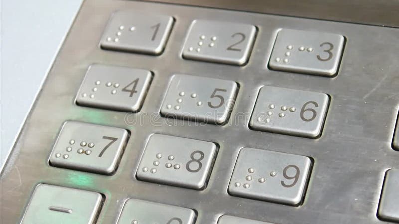 Close-up of a Steel ATM Keyboard Panel and a Male Hand Typing a Pin ...