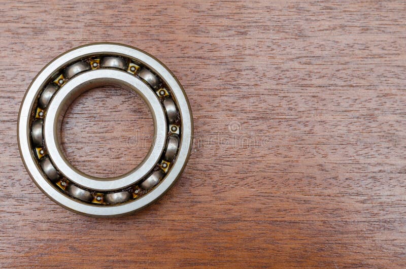Steel Ball Bearings on Wooden Table Stock Image - Image of engine ...
