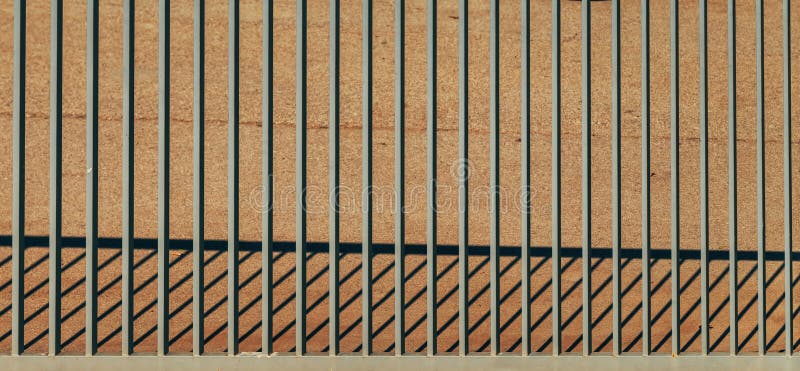 Steel Bar Fence Forming Unique Pattern of Light and Shadow As ...