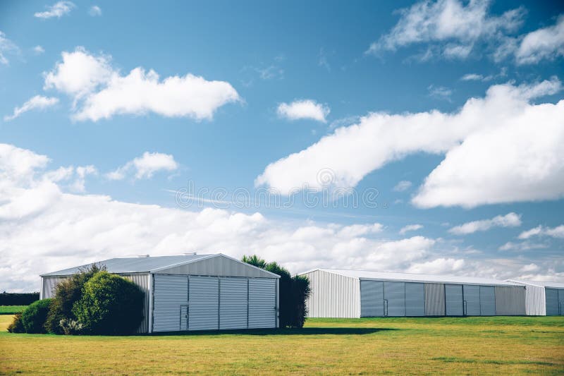 Steel Barn on a Farm with Cloudy Blue Sky Stock Image - Image of green ...