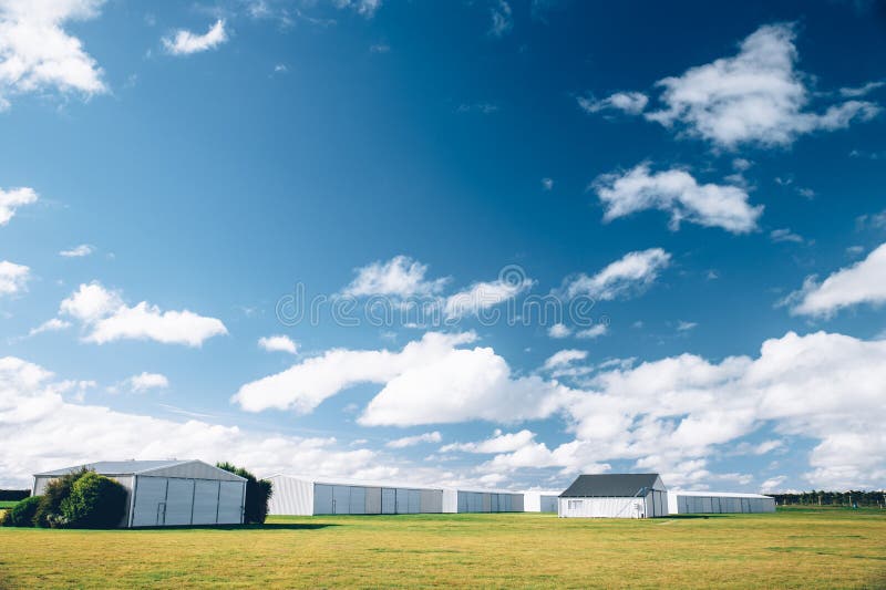 Steel Barn on a Farm with Cloudy Blue Sky Stock Photo - Image of blue ...