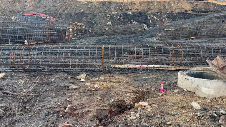 Construction Site Featuring Steel Reinforcement Bars Along with ...