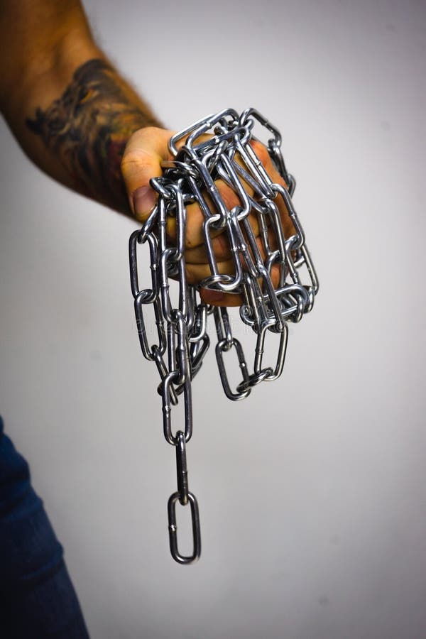 A Steel Chain in the Hand of a Criminal Man Stock Photo - Image of ...