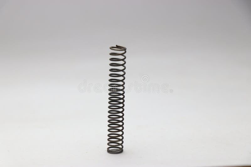 Steel Compression Coil Spring Standing on Its Own on White Background ...