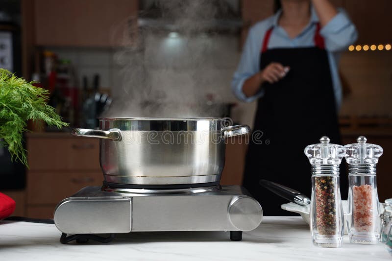 Steel Cooking Pan on Electric Hob with Boiling Water Stock Image ...