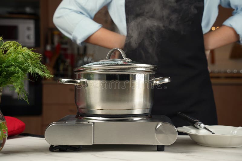 Steel Cooking Pan on Electric Hob with Boiling Water Stock Image ...