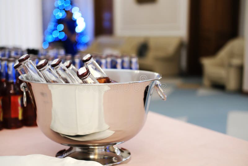 A Steel Cooler with Chilled Bottles Stands on a Buffet Table Stock ...