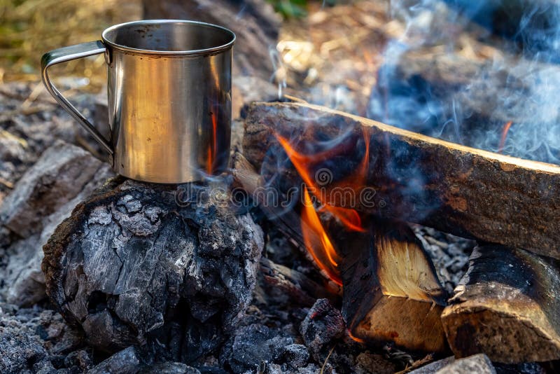 Steel Cup on an Open Fire in Nature. Cooking on Fire Stock Photo ...