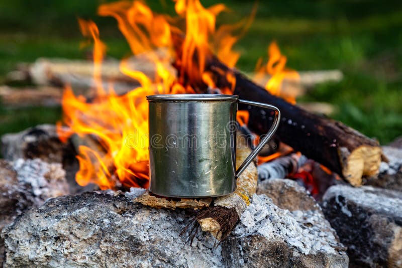 Steel Cup on an Open Fire in Nature. Cooking on Fire Stock Photo ...